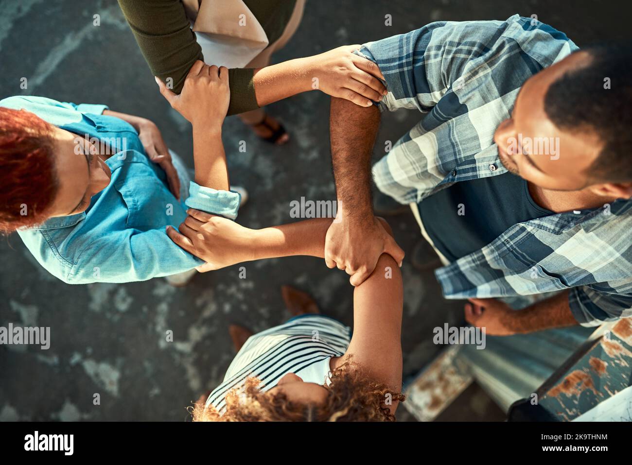 We are locked in and ready to work. High angle shot of a young group of ...