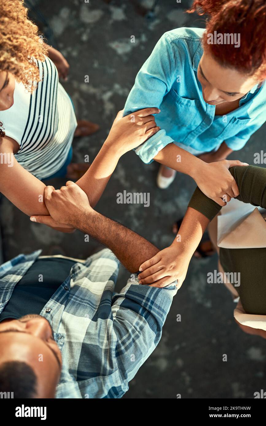 Together we form one collective brain. High angle shot of a young group ...