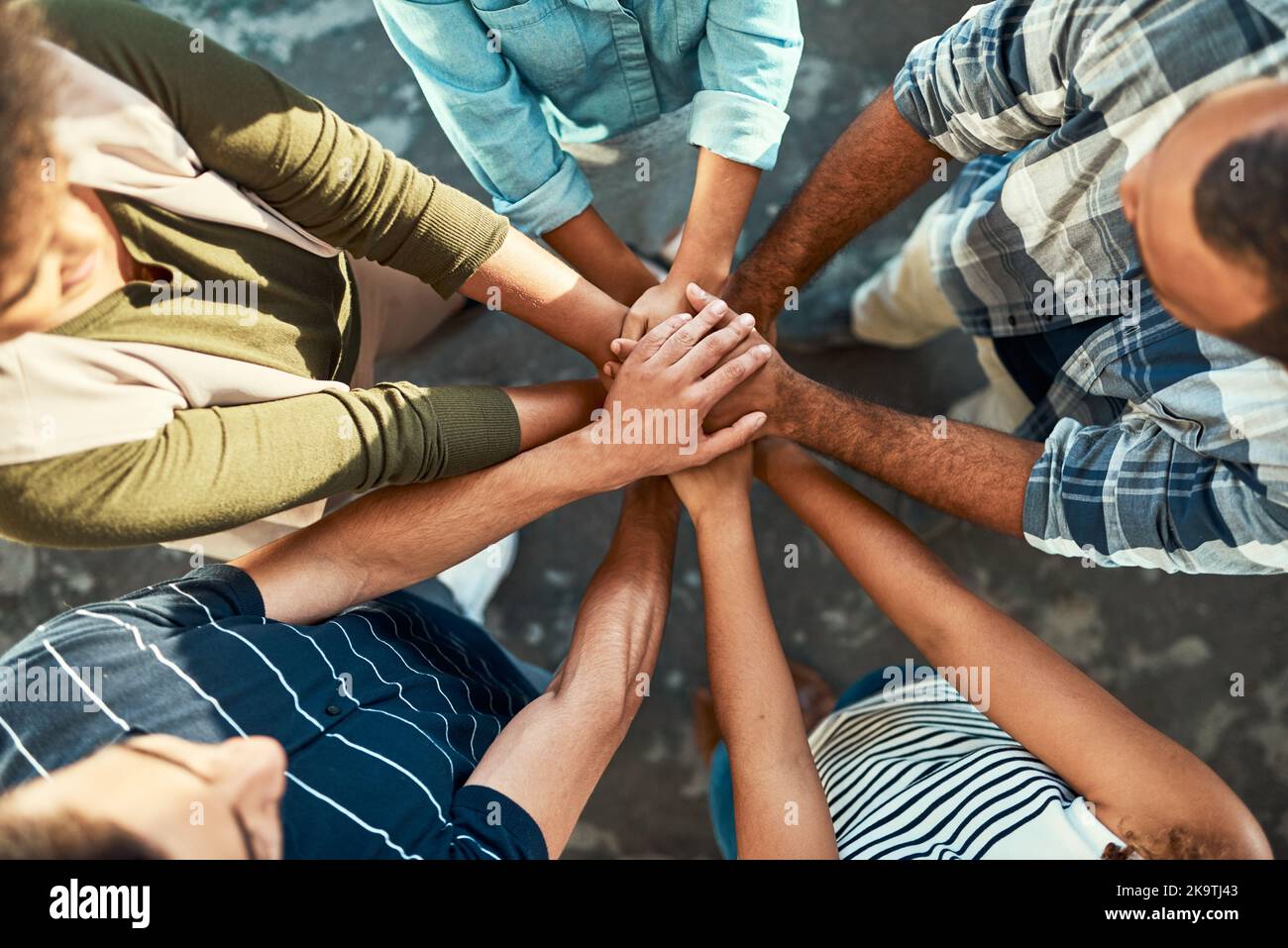 We strive to success together. High angle shot of an unrecognizable ...