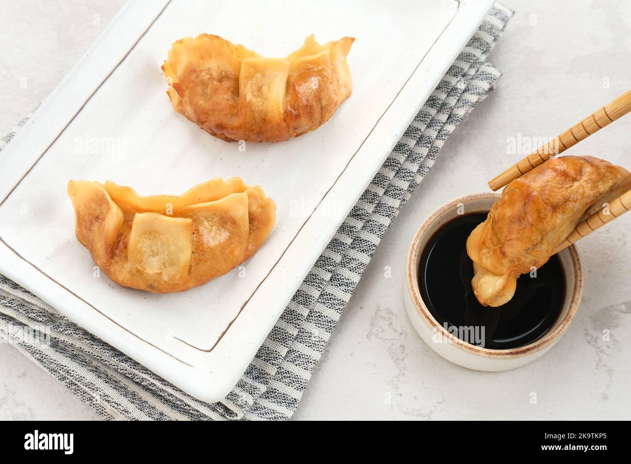 Gyoza, deep fried dumpling with juicy chicken and cabbage. Served in ...
