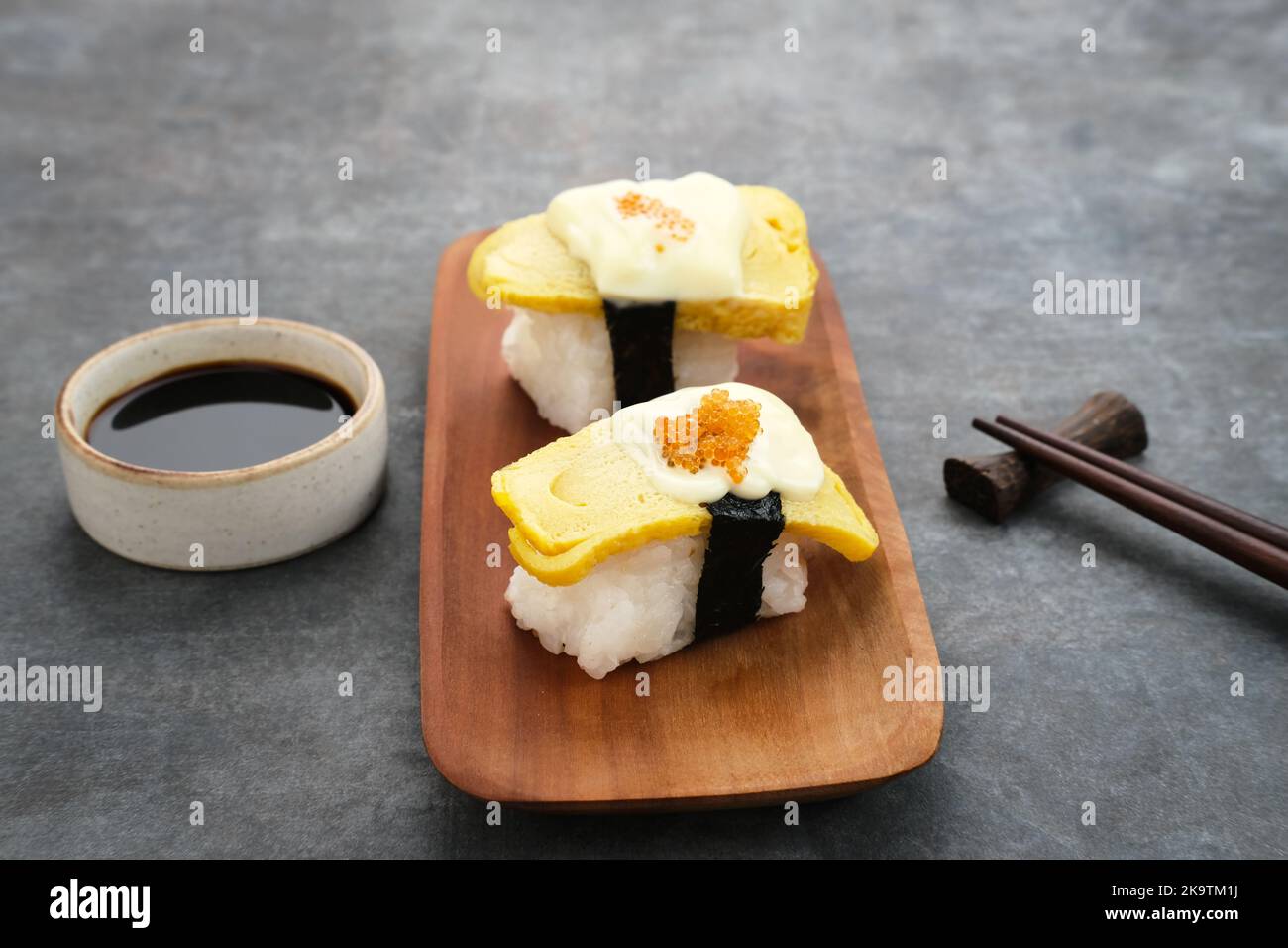 Egg Sushi Rolls or tamago sushi with red caviar, Japanese food Stock ...
