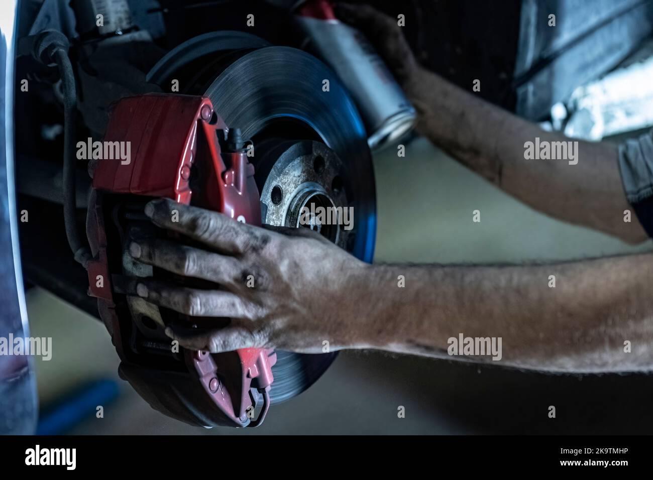 Mechanic hands detail during a maintenance of car brakes Stock Photo ...