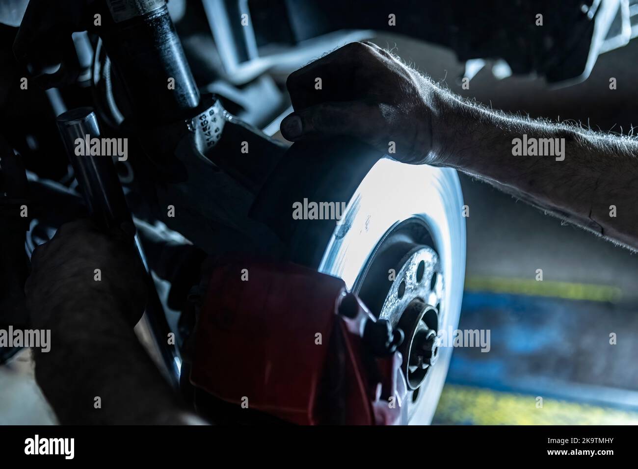 Mechanic hands detail during a maintenance of car brakes Stock Photo ...