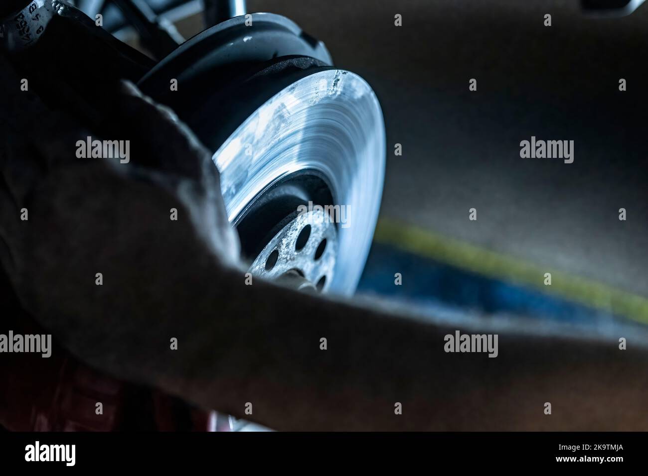 Mechanic hands detail during a maintenance of car brakes Stock Photo ...