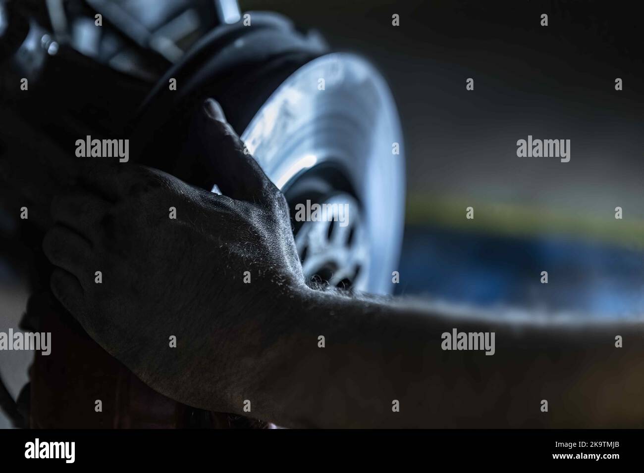 Mechanic hands detail during a maintenance of car brakes Stock Photo ...