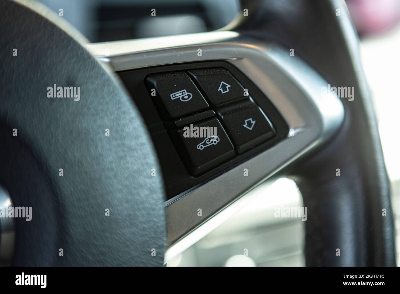 Detail of Buttons on the car's steering wheel Stock Photo - Alamy