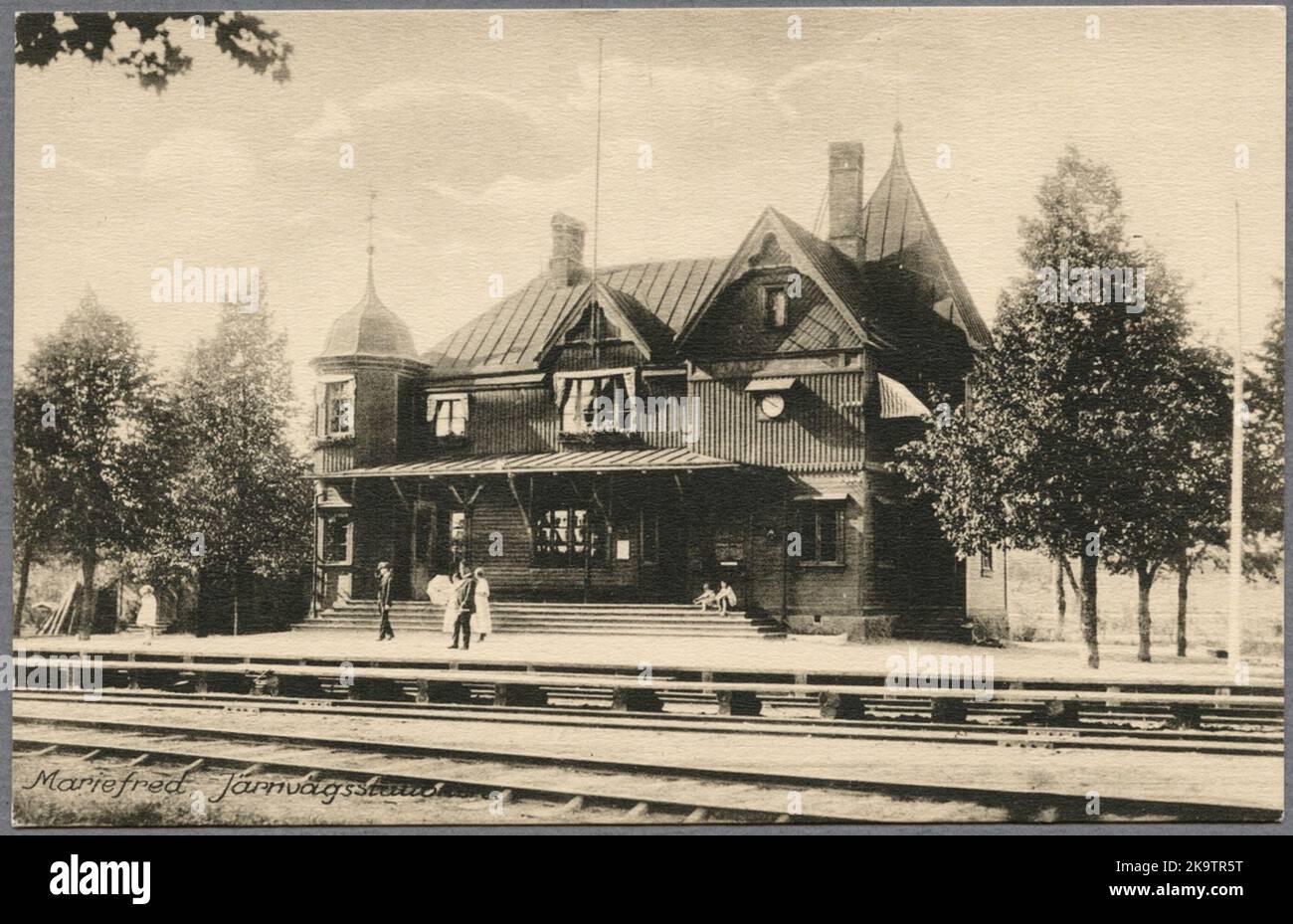 Adults and children in front of Mariefred Railway Station Stock Photo ...