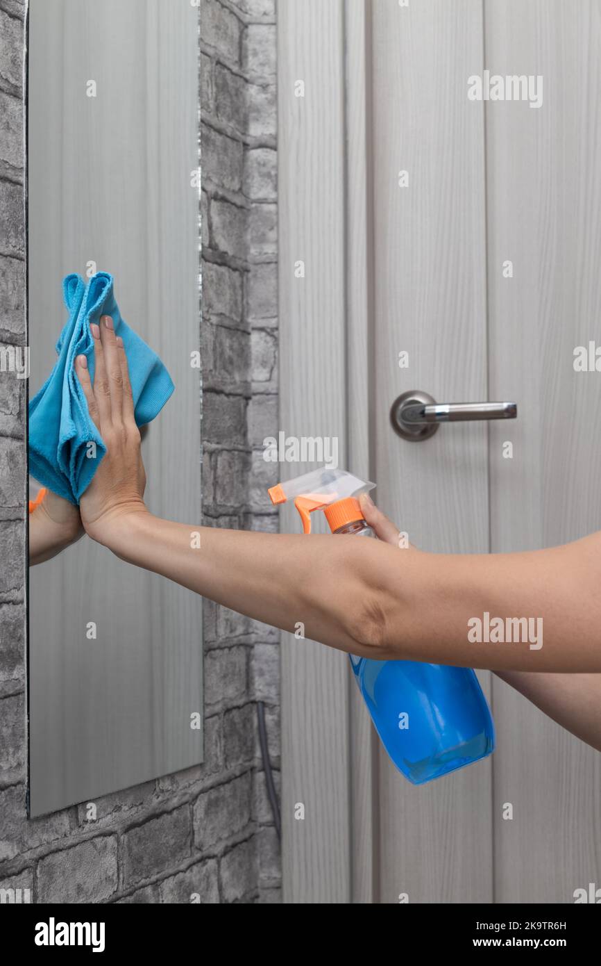 Woman wiping mirror rag hi-res stock photography and images - Alamy