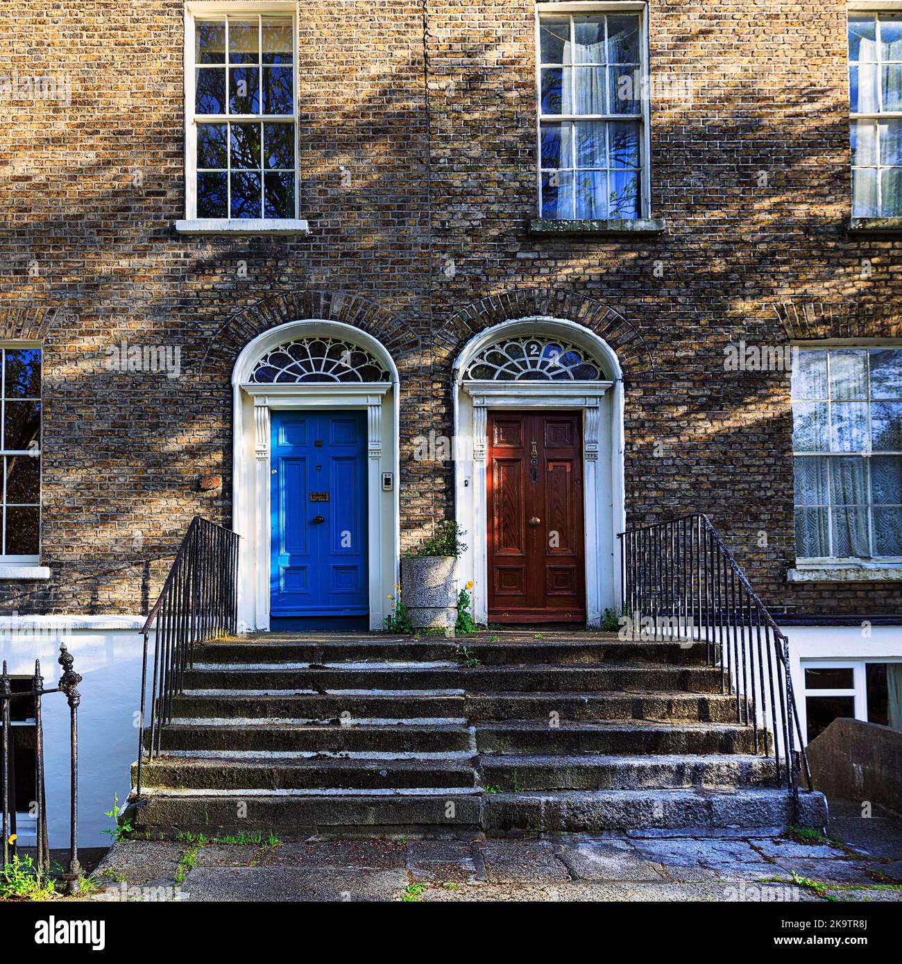Typical terraced houses with colourful doors, blue and red, house ...