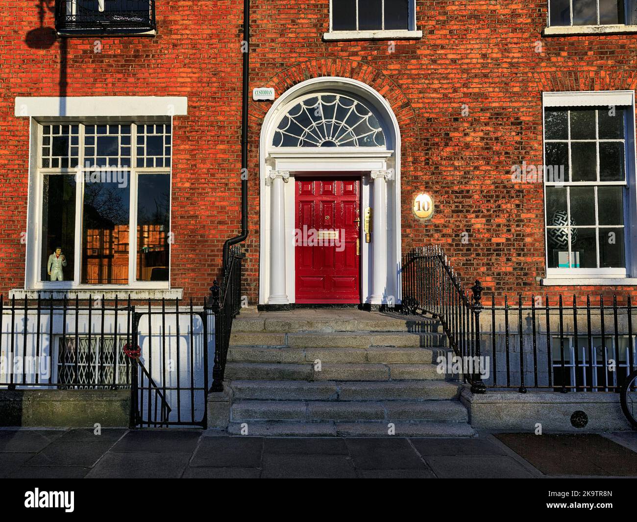 Red door, house entrance with stairs, typical terraced house, Dublin ...