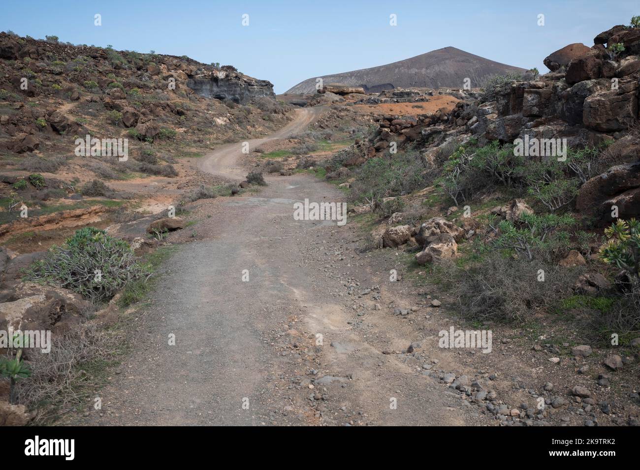 Rocky landscape around the volcano Montana de Guenia, Stratified City ...