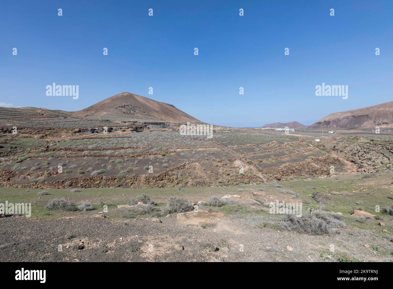 Rocky landscape around the volcano Montana de Guenia, Stratified City ...