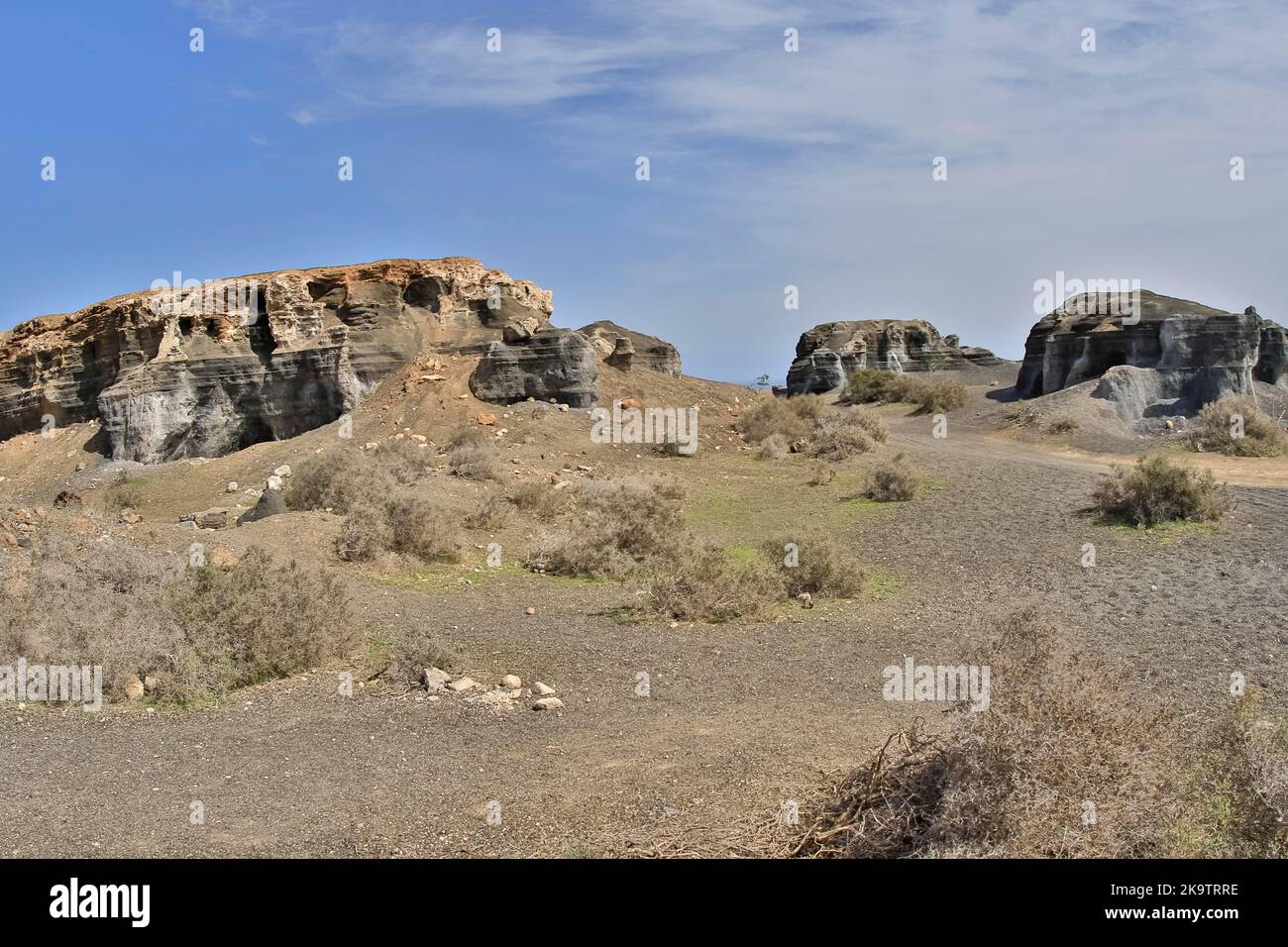 Rocky landscape around the volcano Montana de Guenia, Stratified City ...