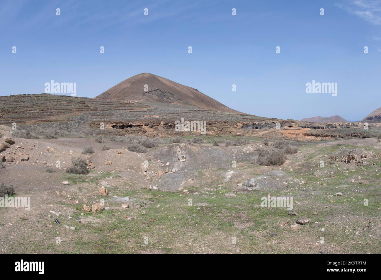 Rocky landscape around the volcano Montana de Guenia, Stratified City ...