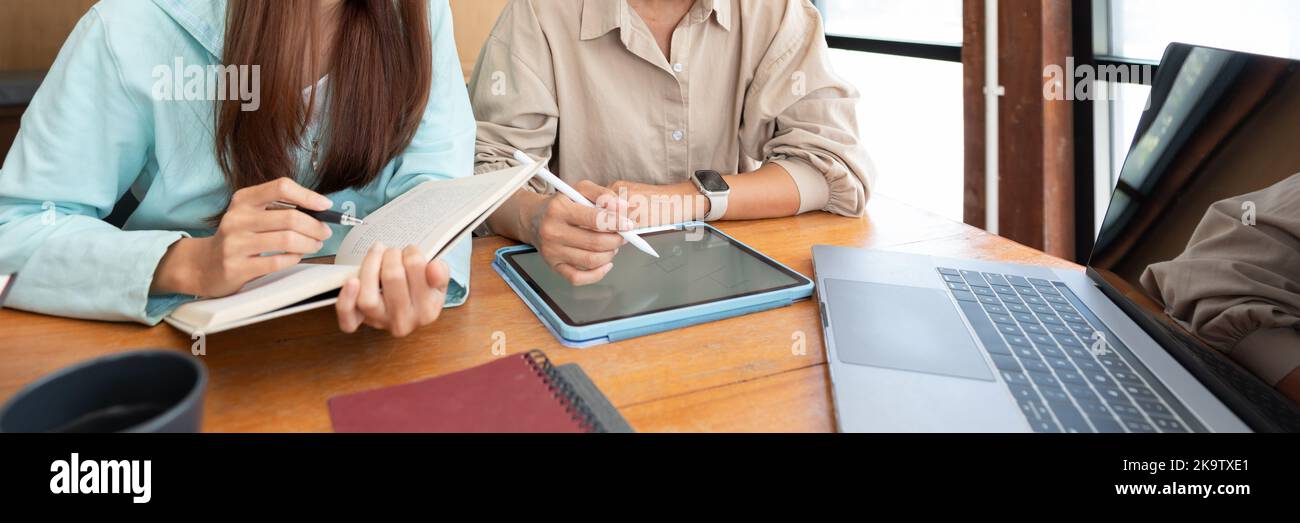 College education concept, Female tutor writing on tablet to tutoring ...