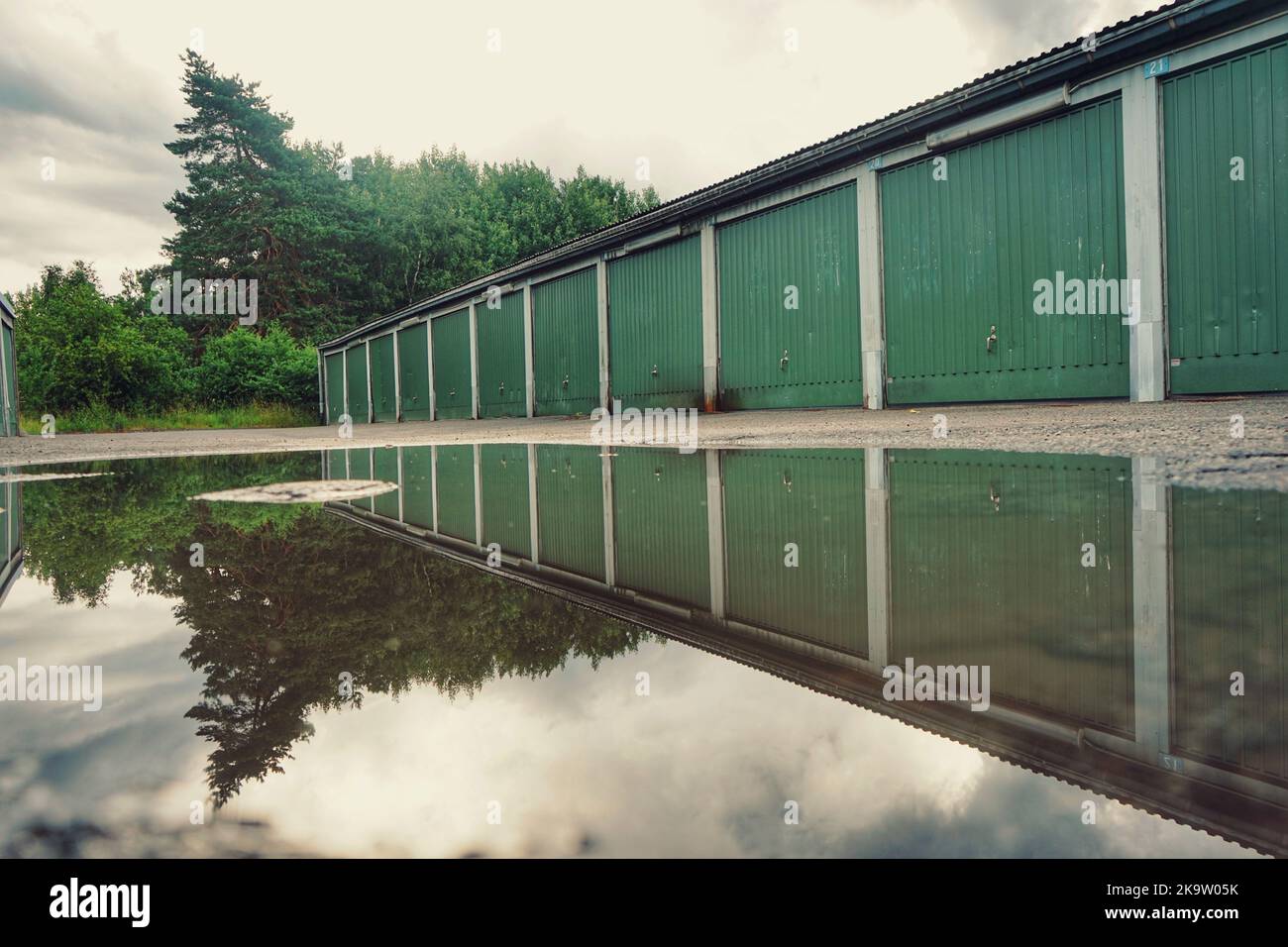 Big puddle next to parking building Stock Photo - Alamy