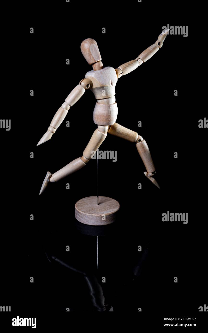 Image of falling wooden manikin on black background, wooden manikin ...