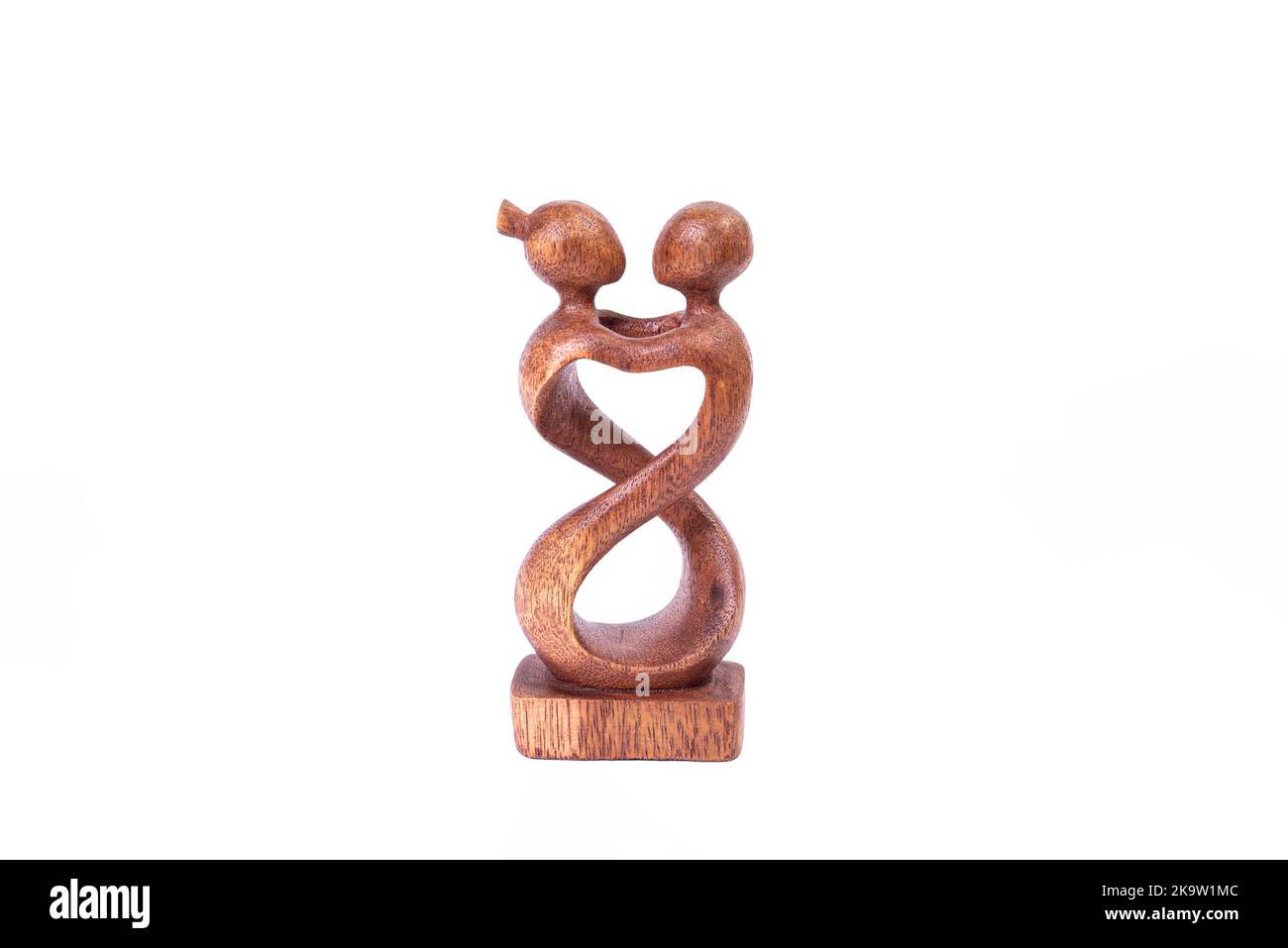 Wooden figurine symbol of love isolated on white background. Carving ...