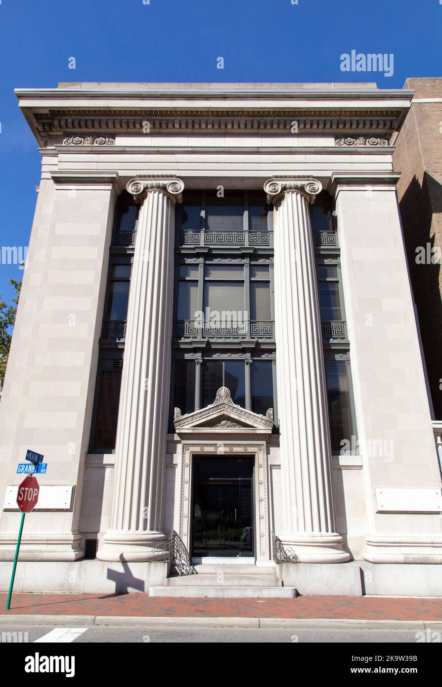 The facade of a historic building with columns on Main Street in ...