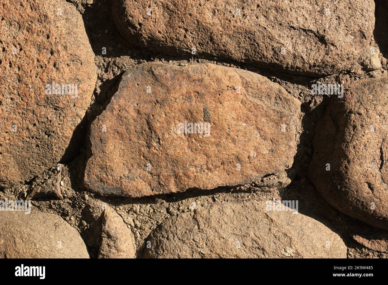 Vintage stone wall with a random pattern Stock Photo - Alamy
