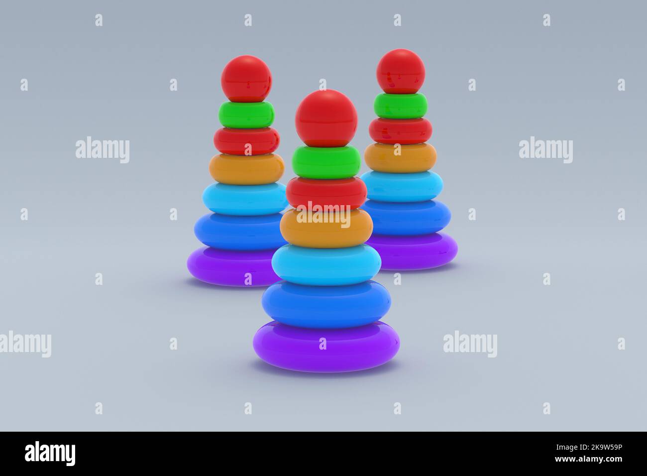 Toy pyramid towers on gray background. Children education. Educational ...