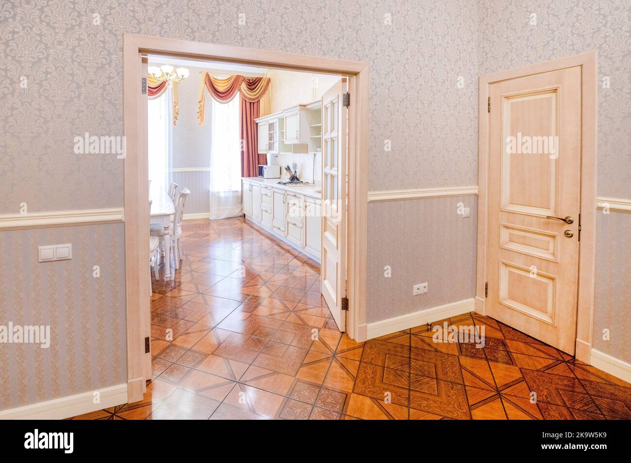 Hallway a house with a wooden floor and doors to other rooms Stock ...