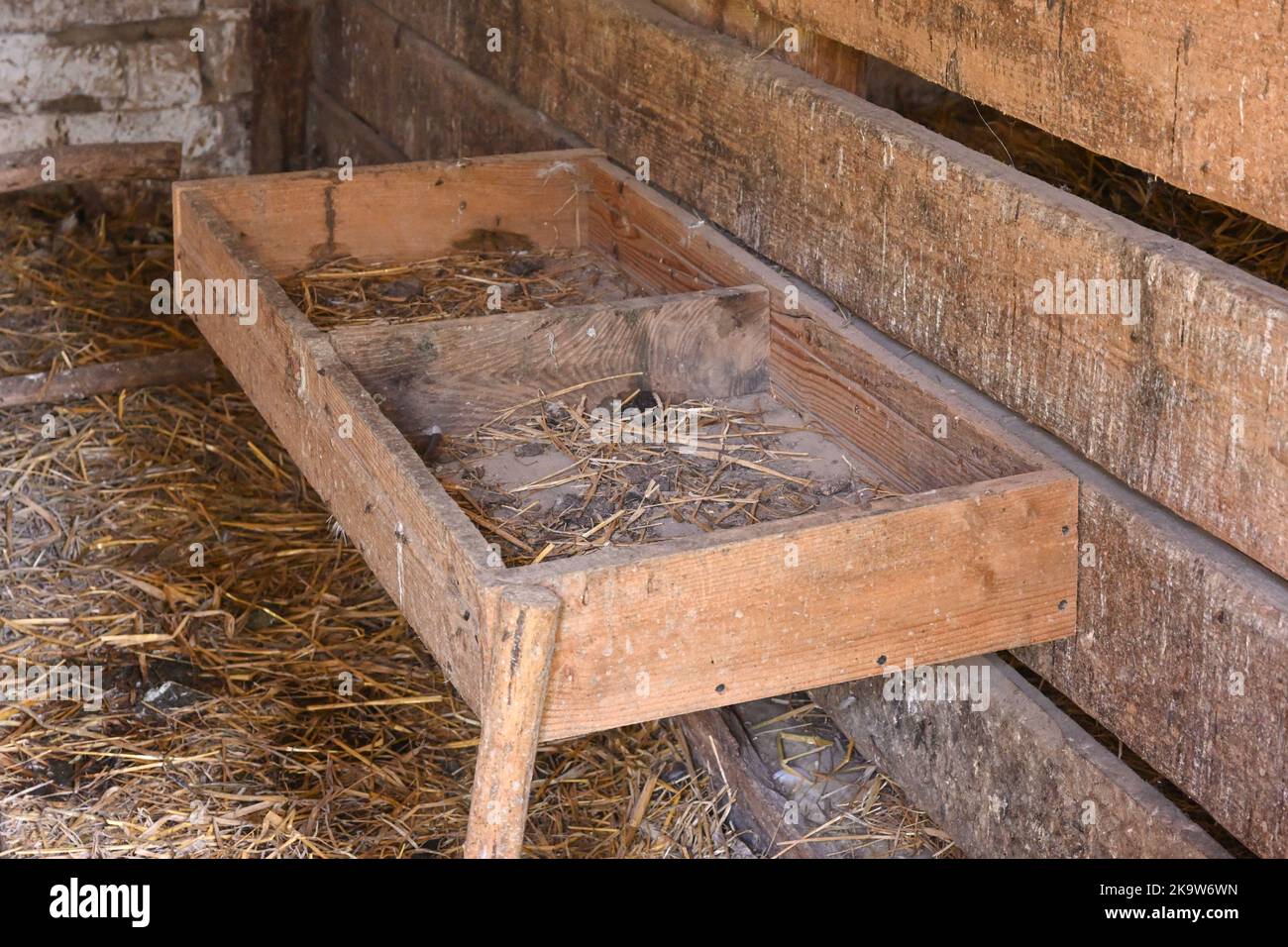 Hens nests in the hen house. Interior of hen house Stock Photo - Alamy