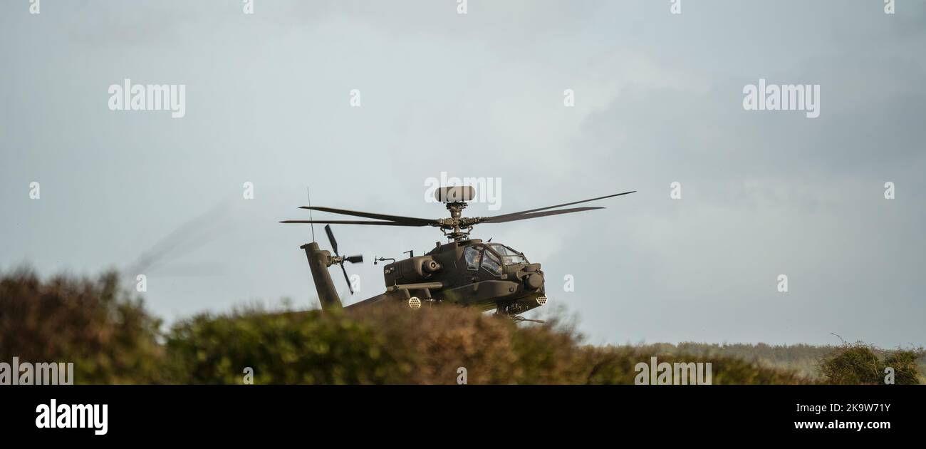 close-up head-on view of a British army Boeing Apache Attack helicopter ...