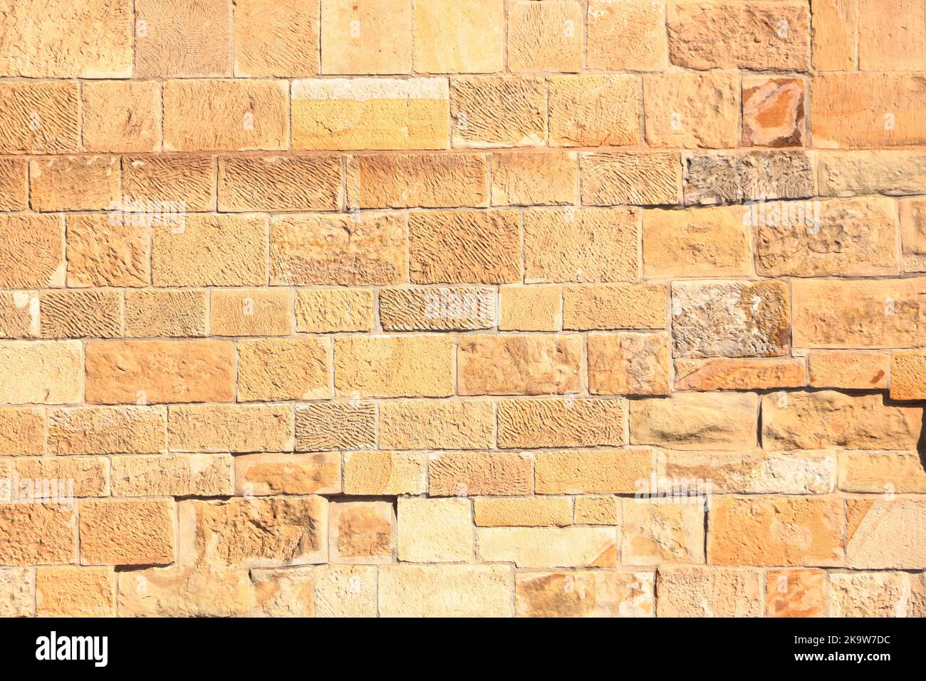 a Big yellow wall made from stone bricks Stock Photo - Alamy