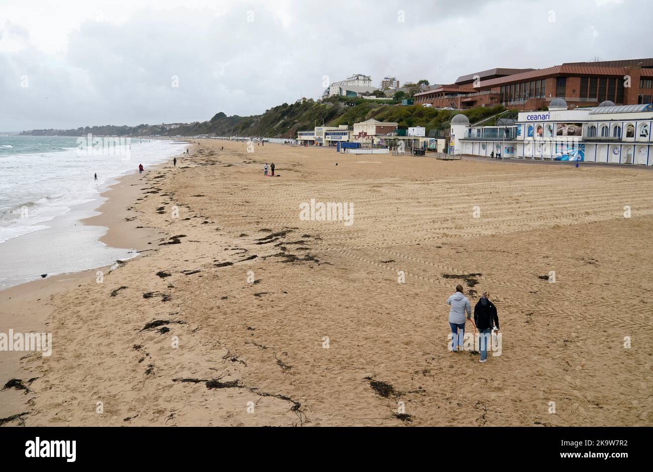People make their way along Bournemouth beach in Dorset. Picture date ...