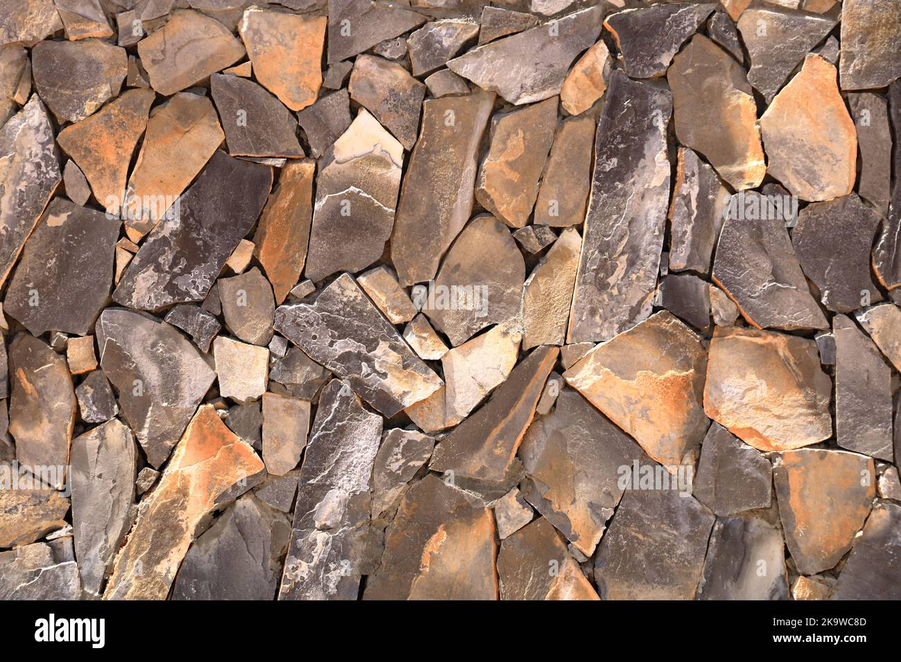 a Grey Yellow Stonewall Made From Flagstone And Sandstone Slabs ...