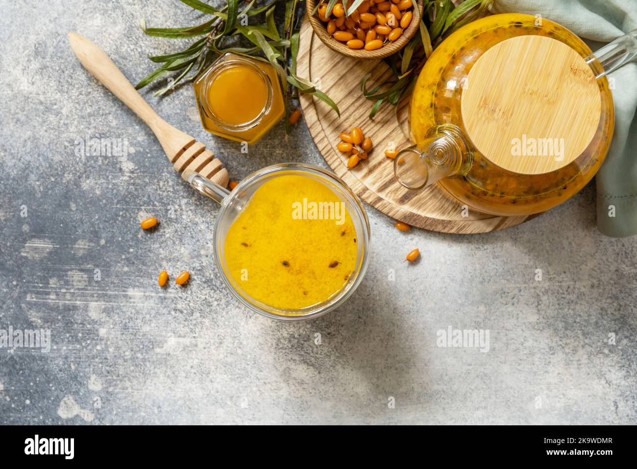 Sea buckthorn and cup of healthy sea buckthorn tea with honey on a ...