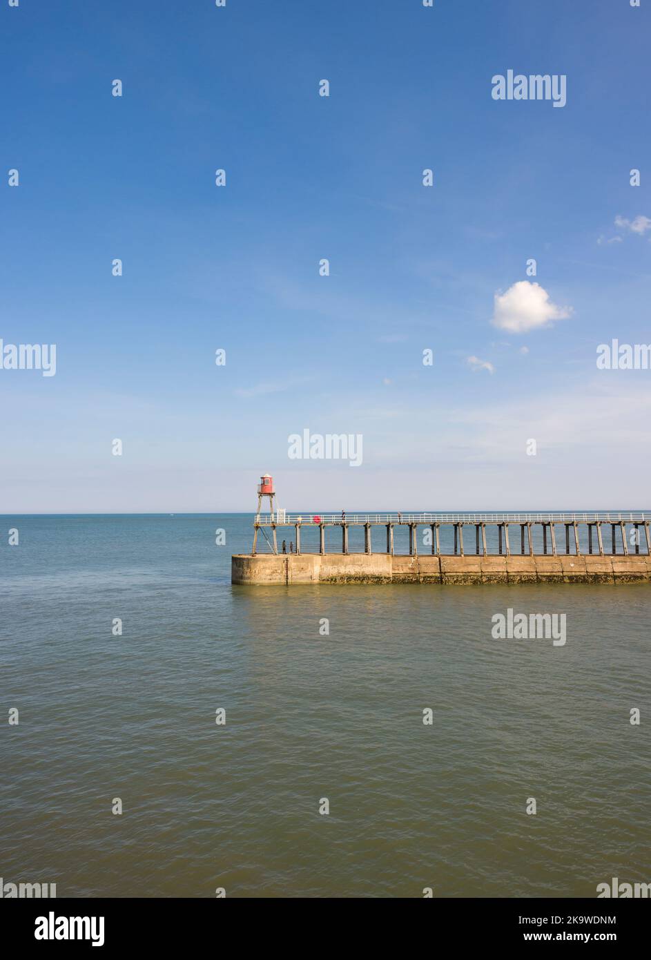 WHITBY, UK - September 21, 2022. Whitby harbour wall with North Sea and ...