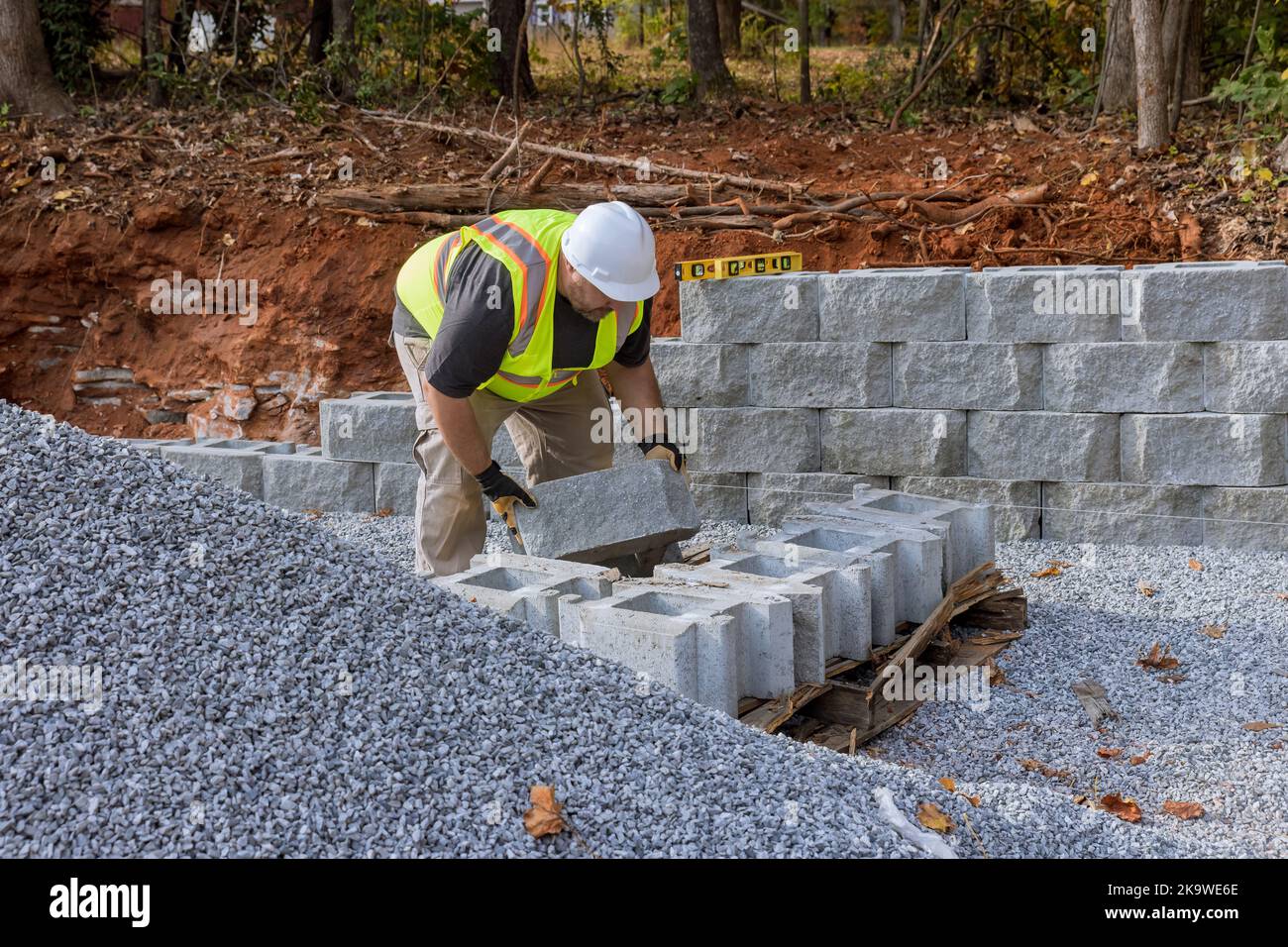 Contractor are working during the installation large block retaining ...
