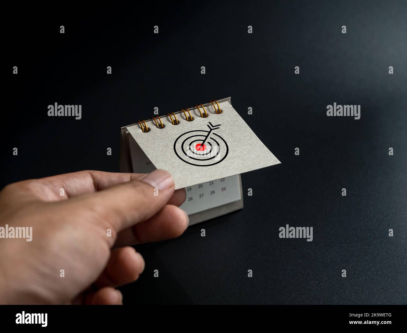 Start new goals in new year concept. Close-up target icon on small grey ...