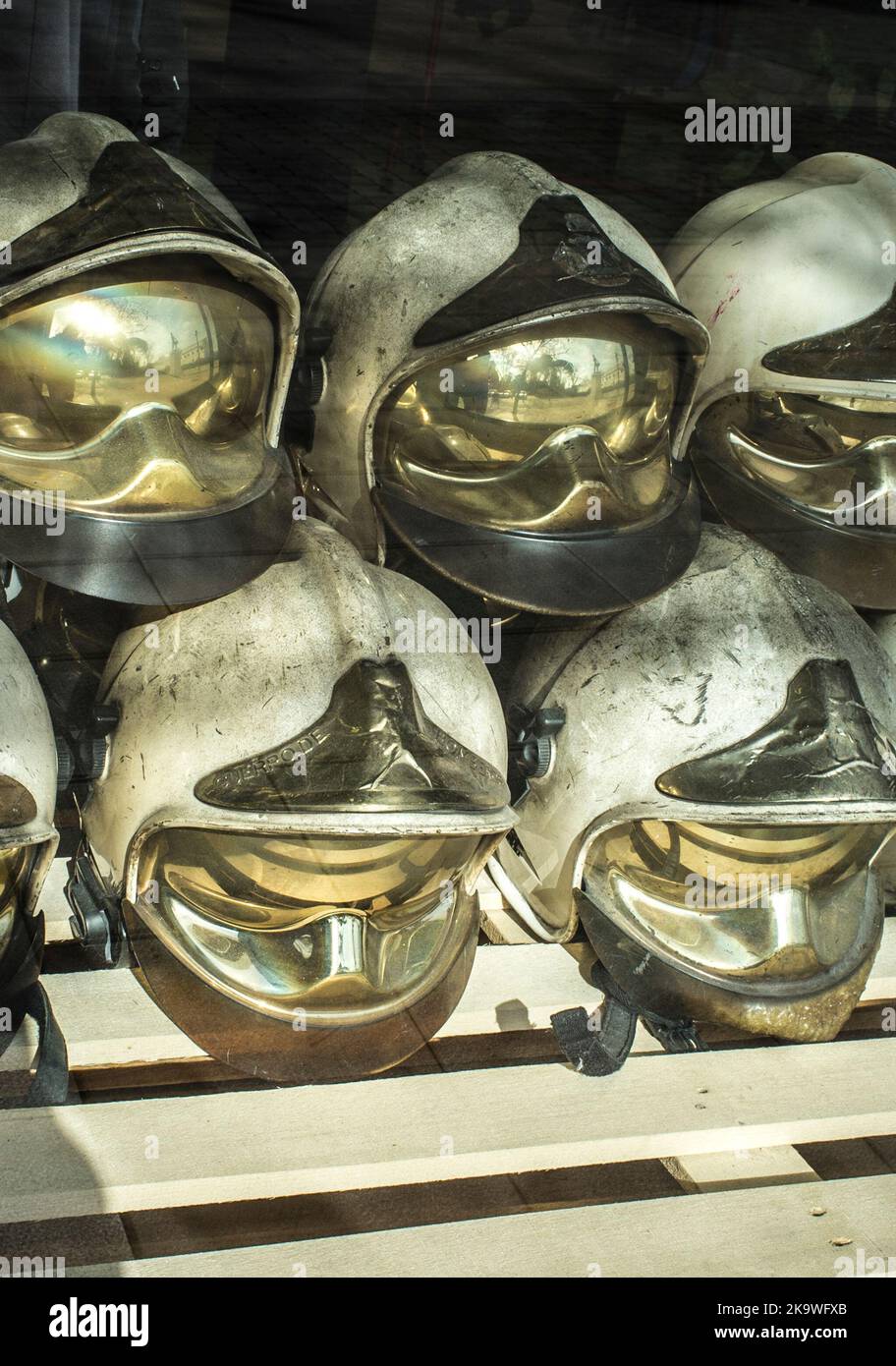 Pile of old firefighter helmets. Obsolete firefighter equipment Stock ...
