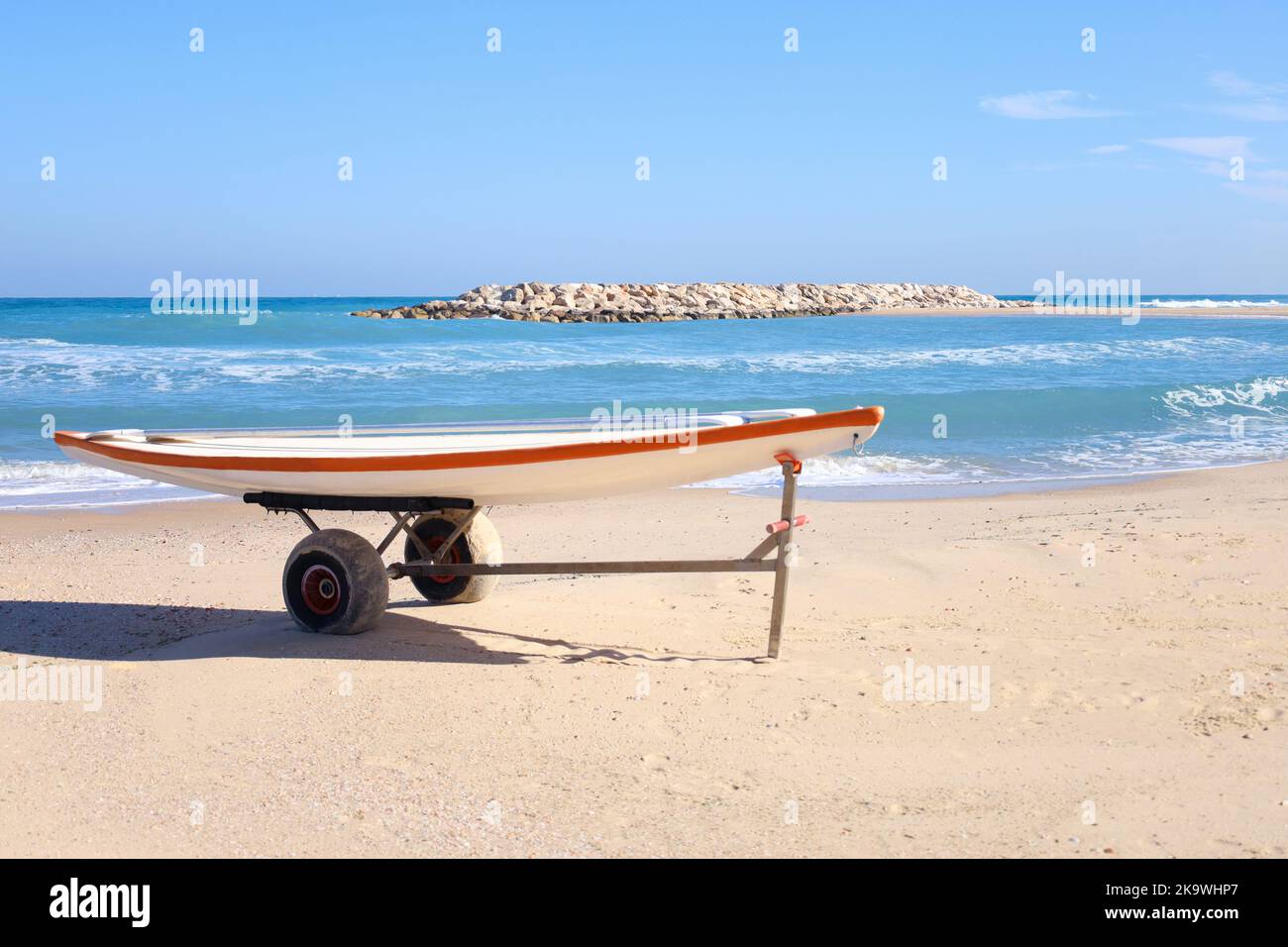 Modern boat on sand near sea Stock Photo - Alamy