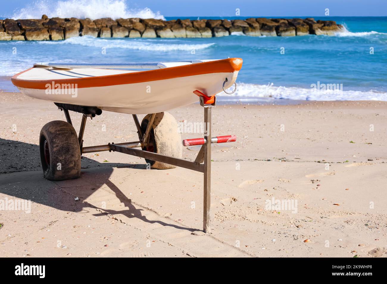 Modern boat on sand near sea Stock Photo - Alamy