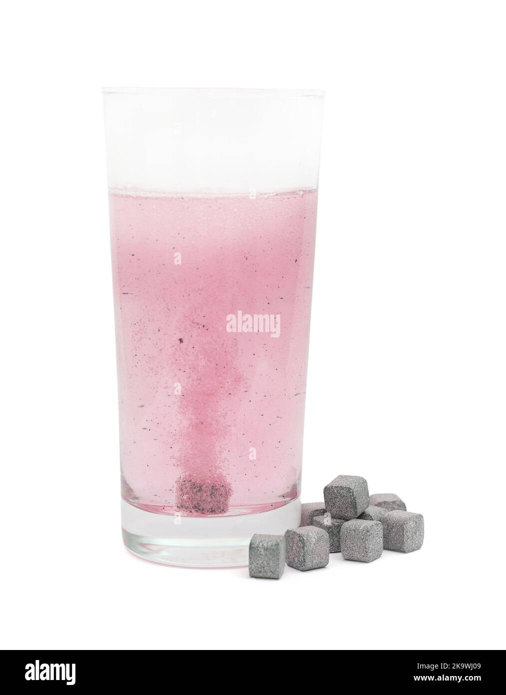 Glass of water with soluble tablets on white background Stock Photo - Alamy