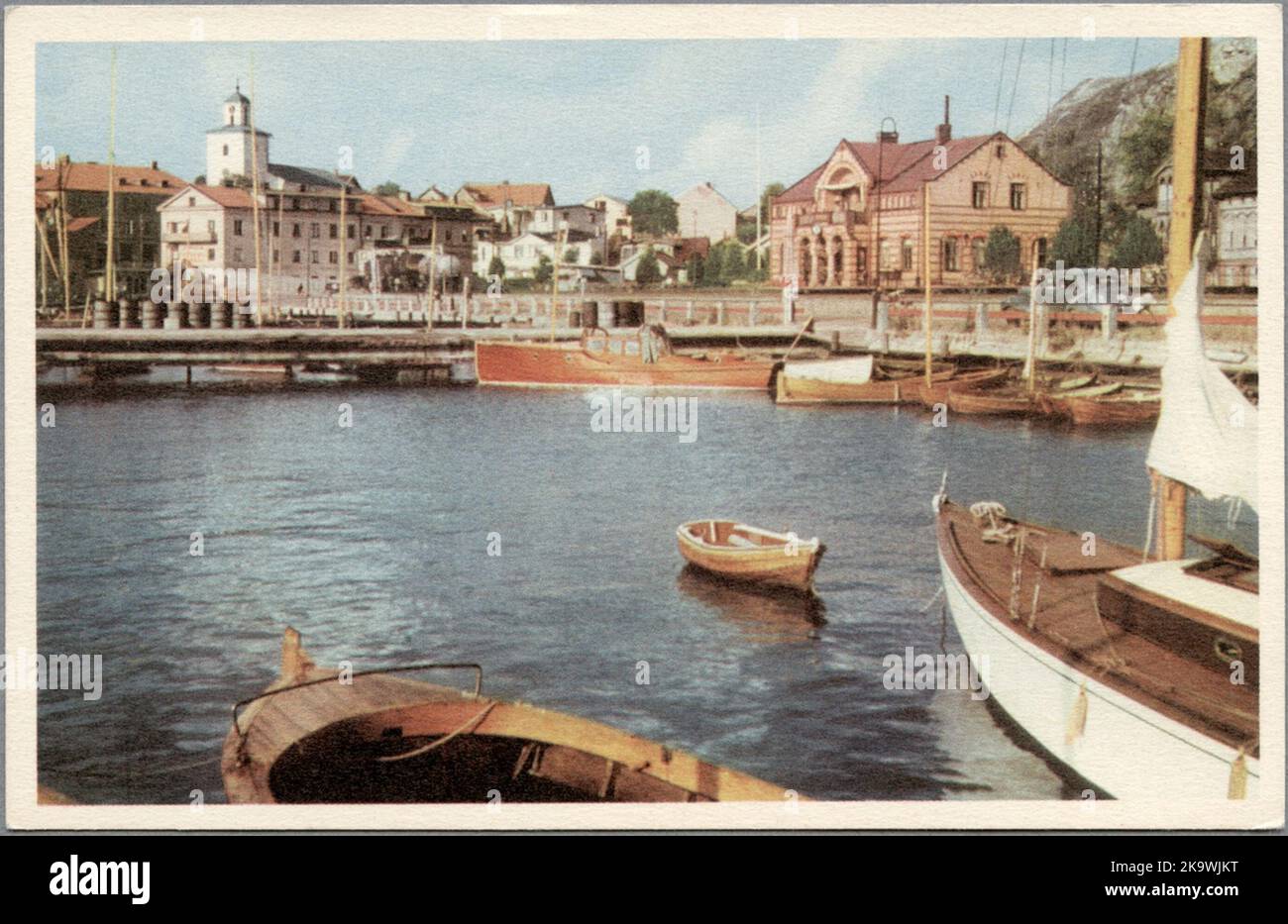 The railway station and church in Strömstad photographed from boat or ...