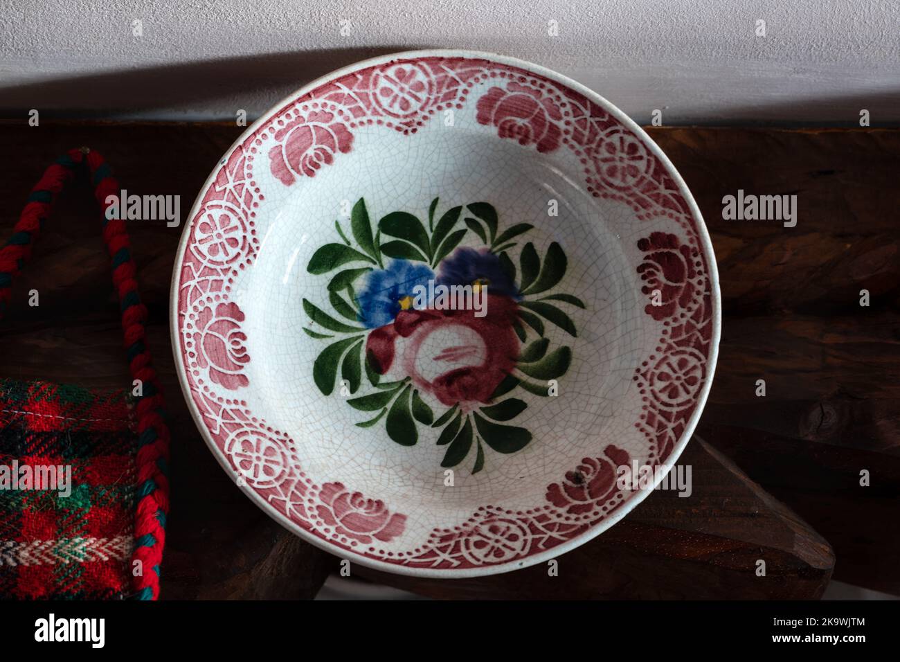 A vintage traditional handmade pottery plate from Romania displayed on ...