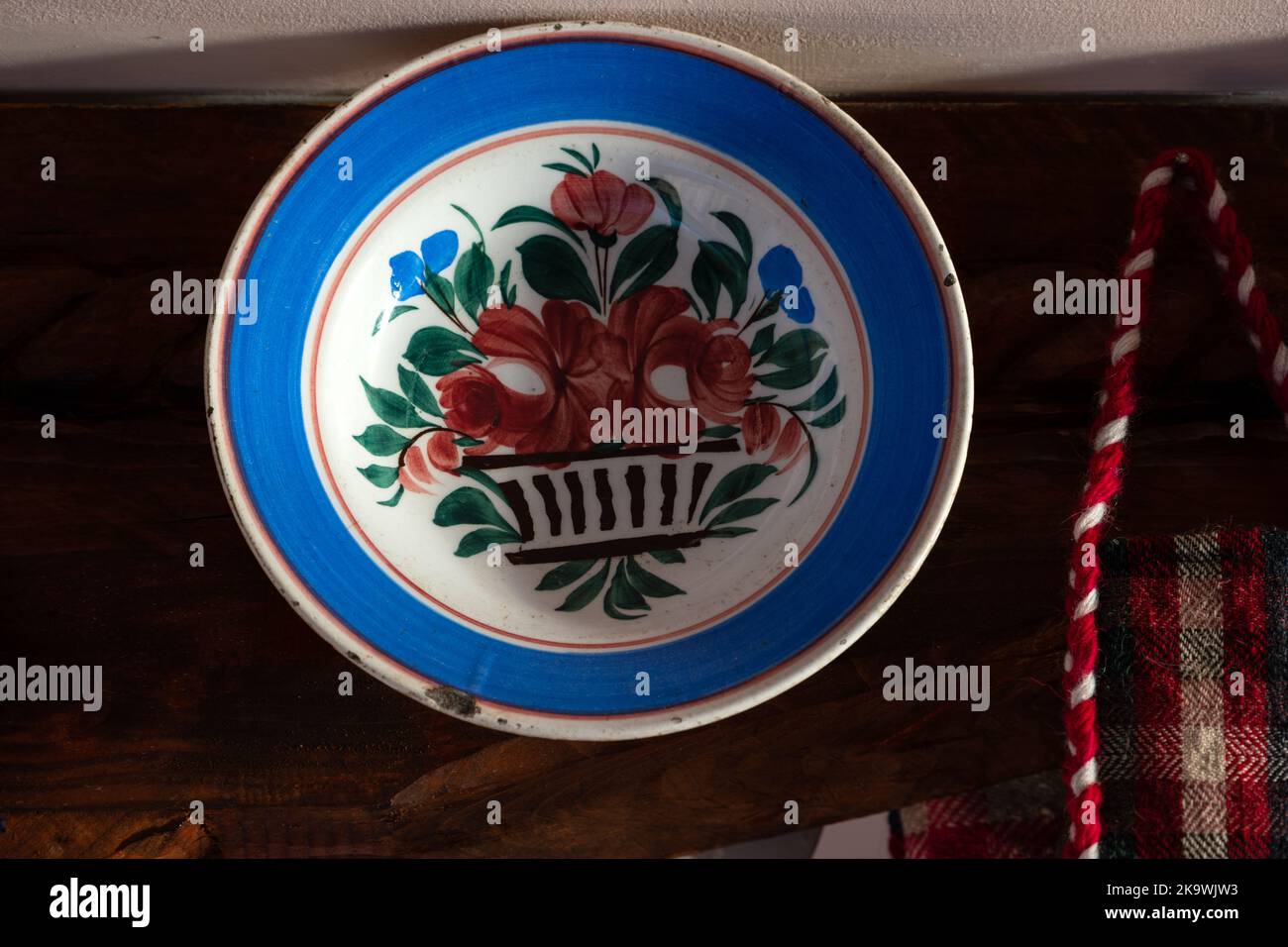 A vintage traditional handmade pottery plate from Romania displayed on ...