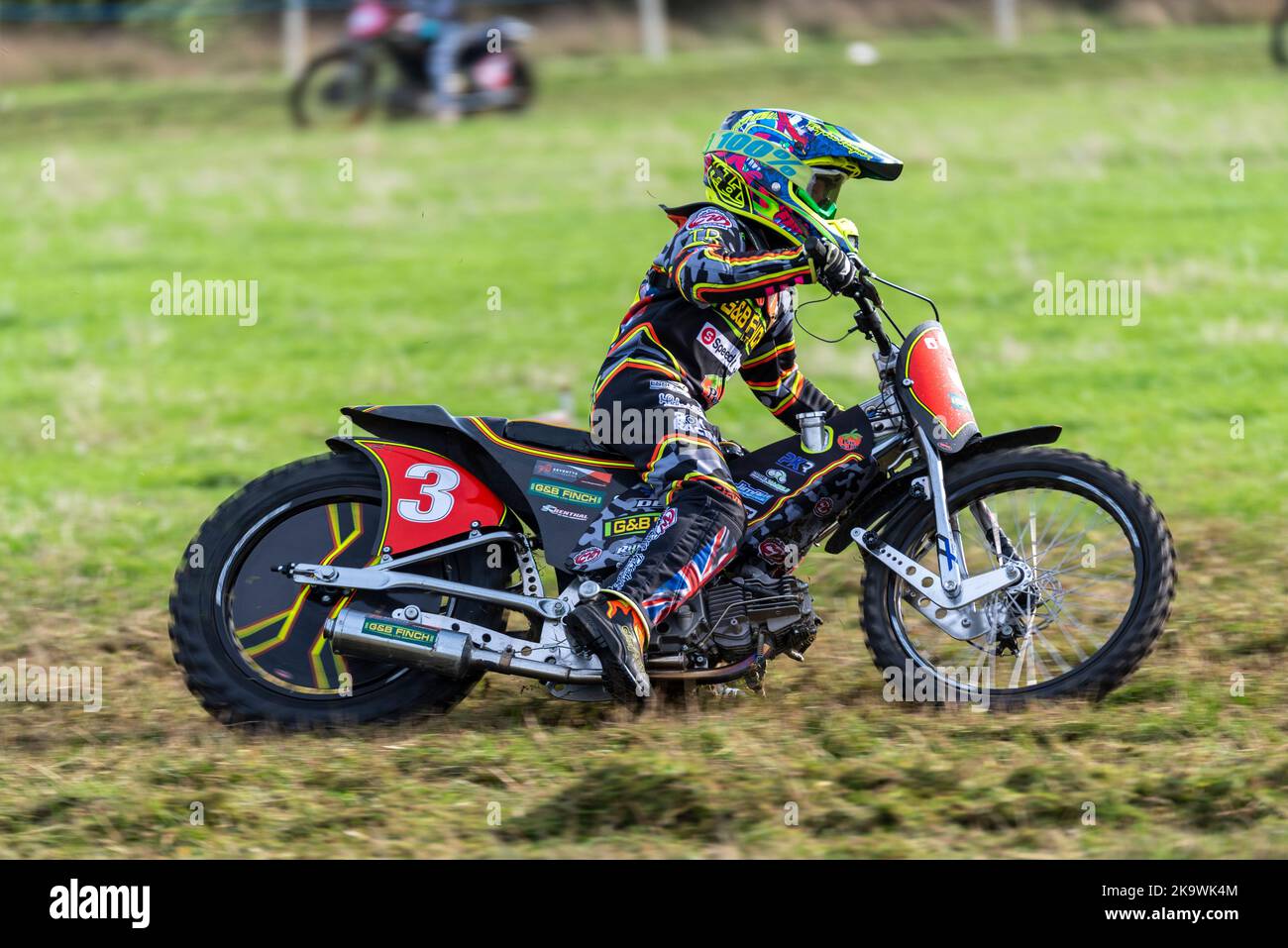 Archie Rolph racing in a grasstrack motorcycle race. Donut Meeting ...