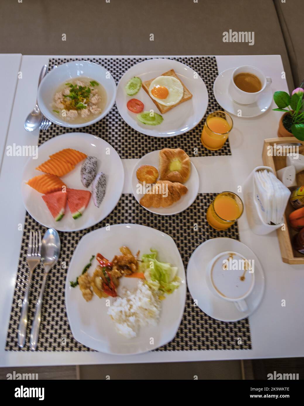 view at a simple breakfast table at a hotel. breakfast table with bread ...