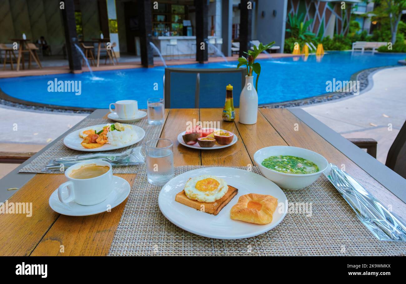 view at a simple breakfast table at a hotel. breakfast table with bread ...