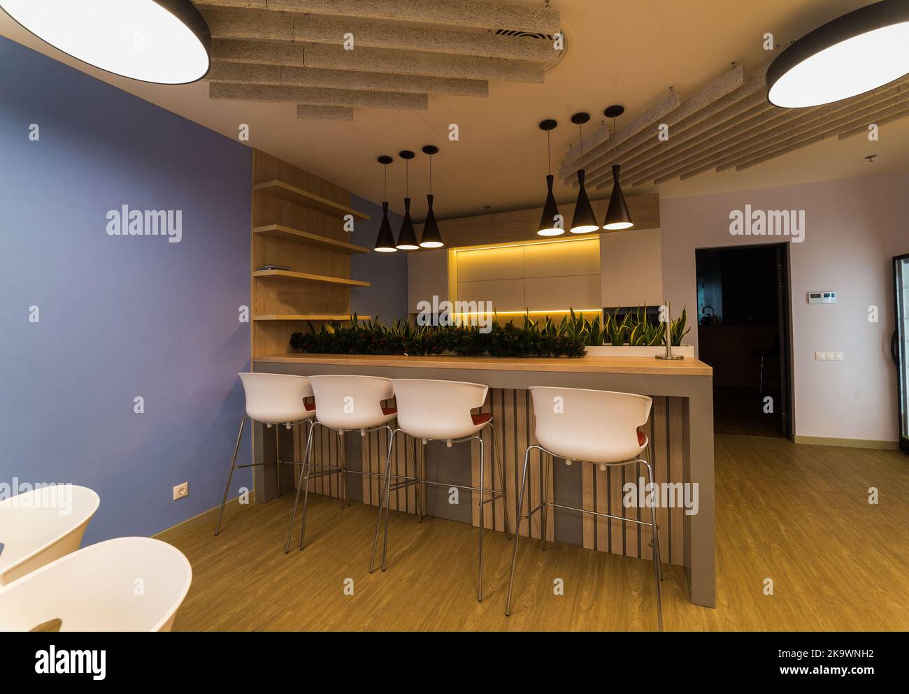 Meeting zone in the office in a loft style with white brick walls and ...