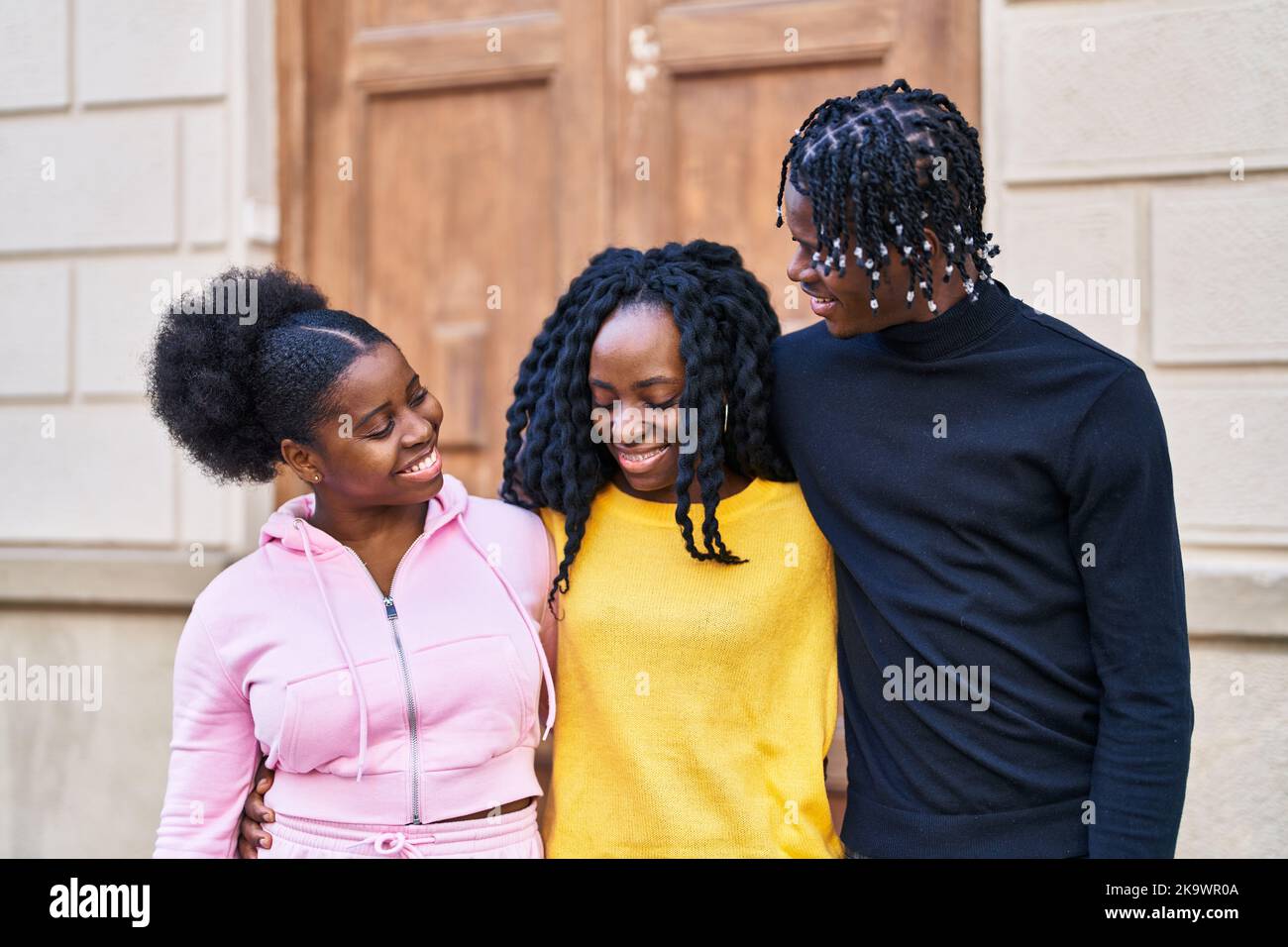 African american friends smiling confident standing together at street ...