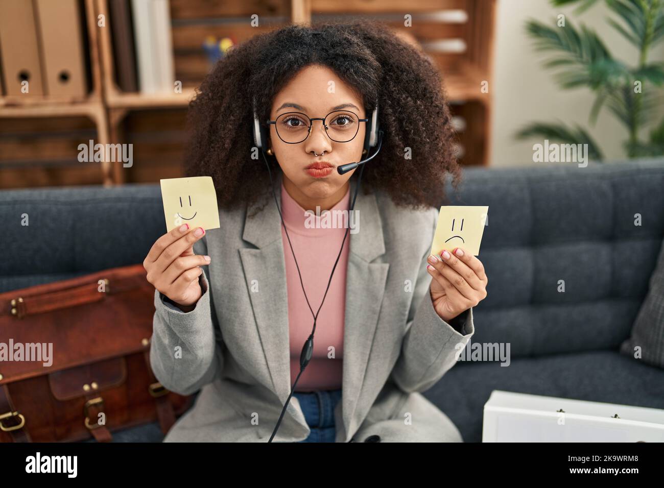 Young african american woman working therapy for depression puffing ...