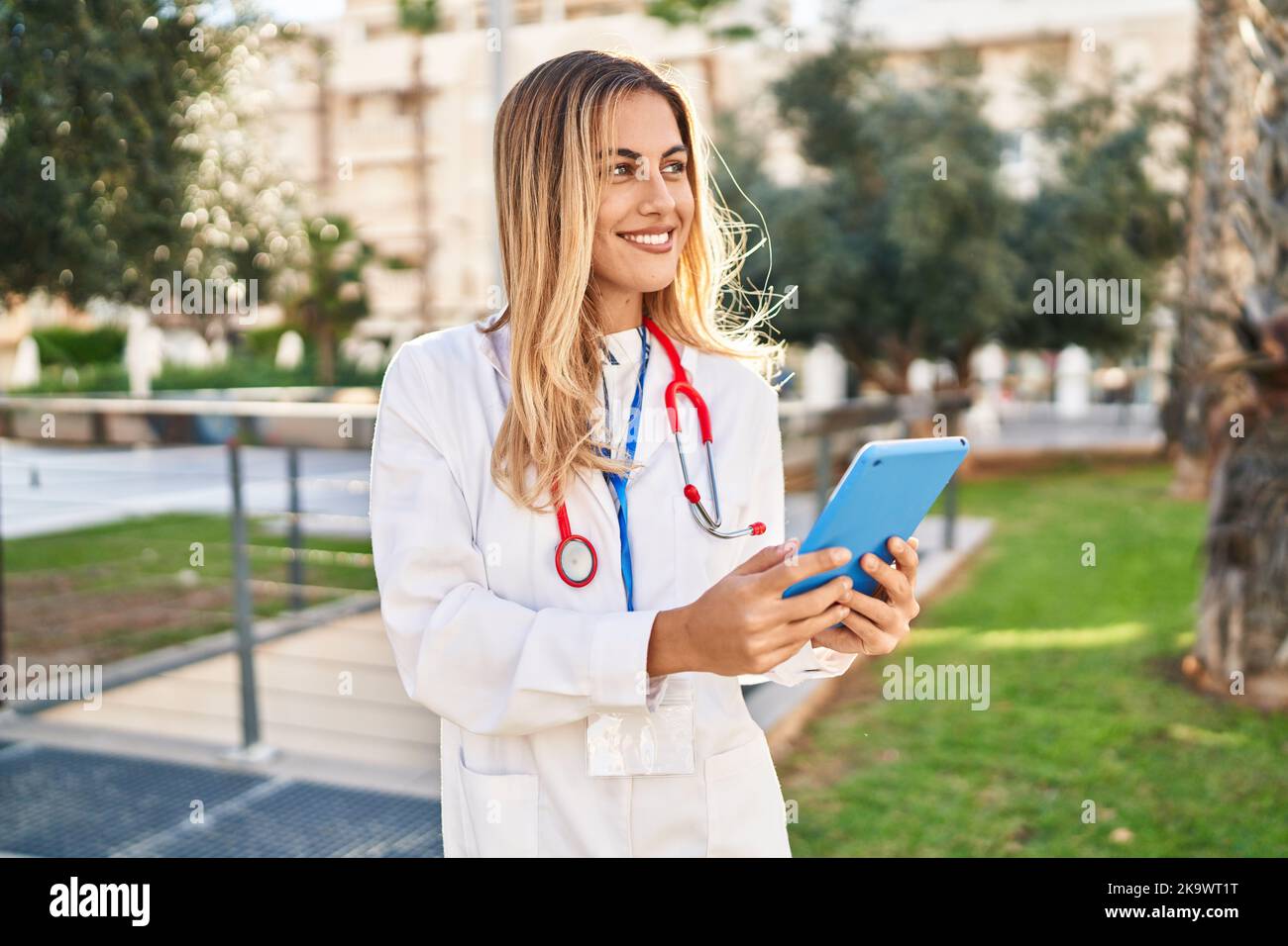Woman doctor using tablet outside hi-res stock photography and images ...