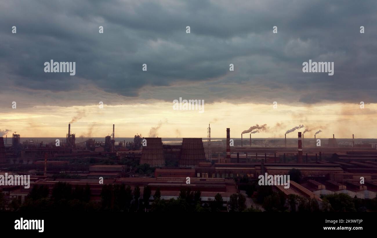 heavy industry with air pollution produced by a large factory. climate ...